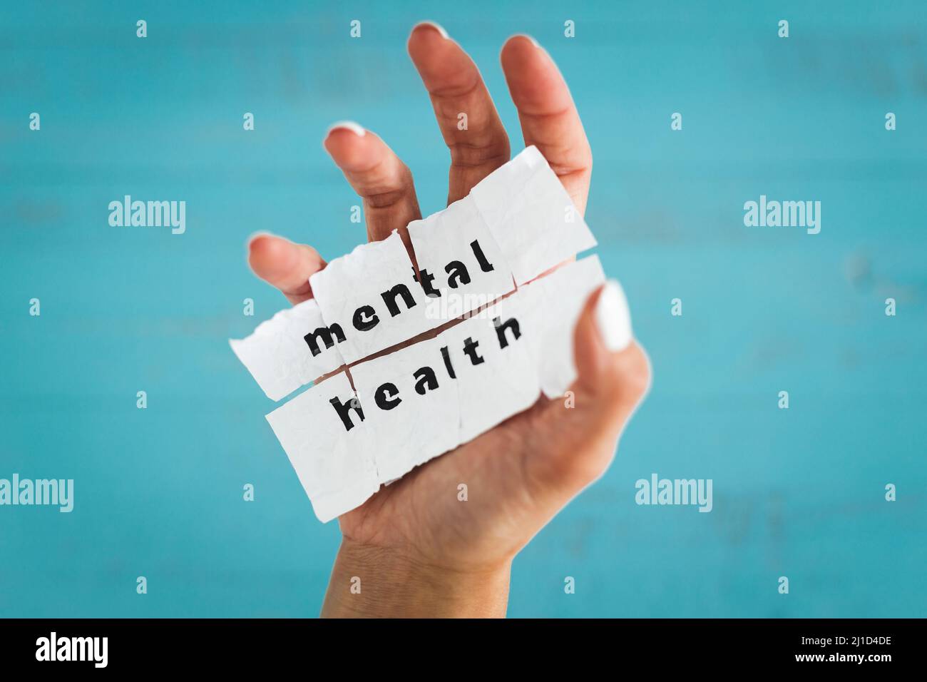 Scrunched up paper hand hi-res stock photography and images - Alamy