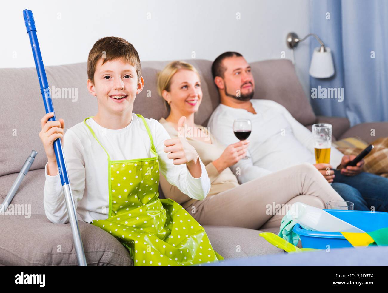 Happy boy dressed for cleaning Stock Photo - Alamy