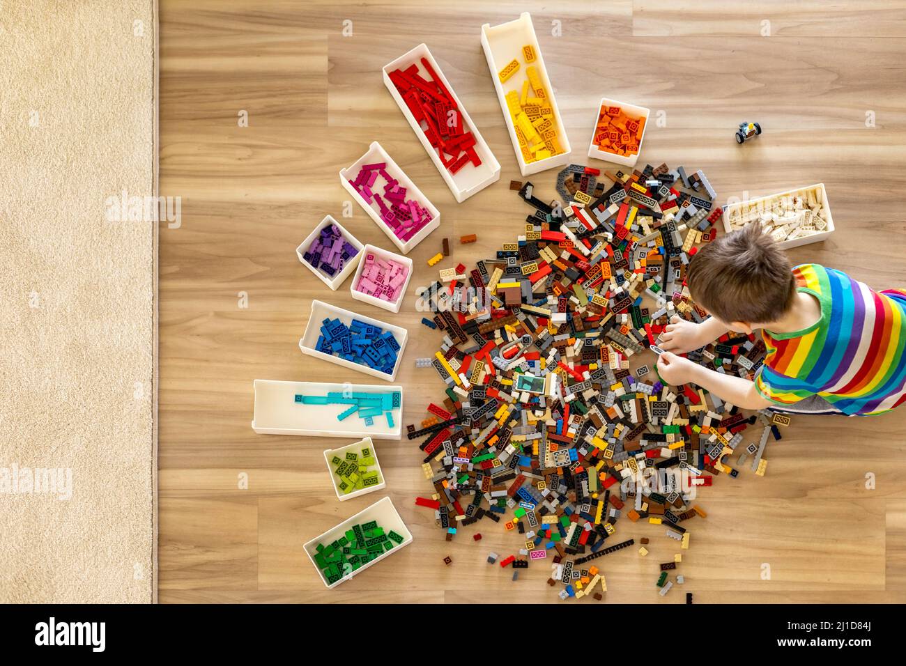 Khabarovsk, Russia, February 25, 2022. Cute baby boy sorting Lego ...