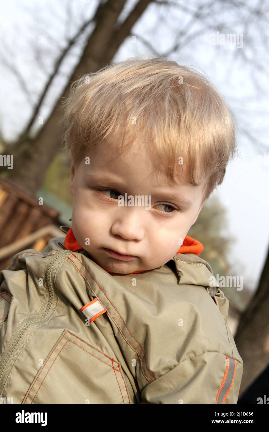 The portrait of the sad boy outdoor Stock Photo - Alamy
