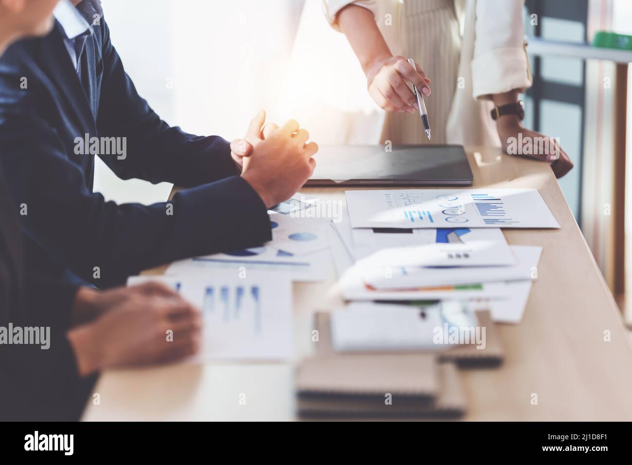 Business people discussing and consulting marketing plan at exclusive ...