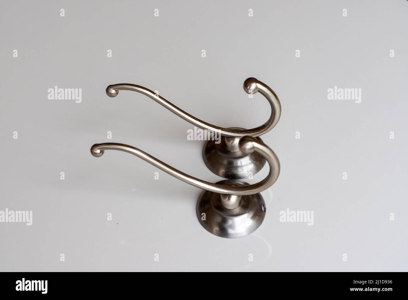 Stainless steel hooks on white background with copy space Stock Photo ...