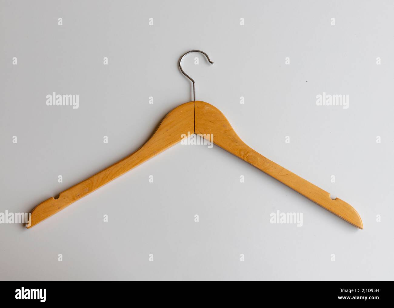Single wood hanger on white background Stock Photo - Alamy