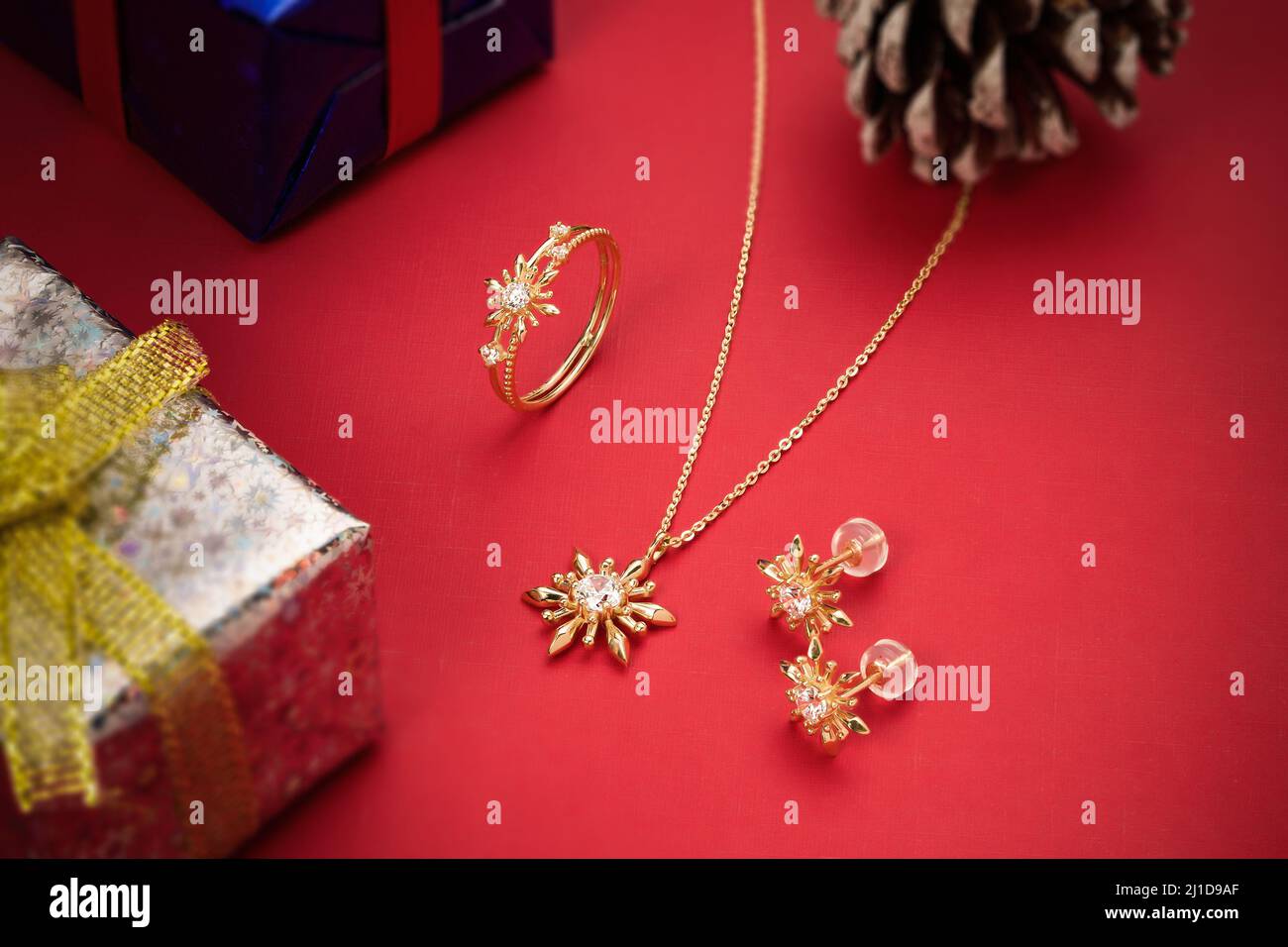 A festive and elegant gold jewelry set styled with holiday charm ...