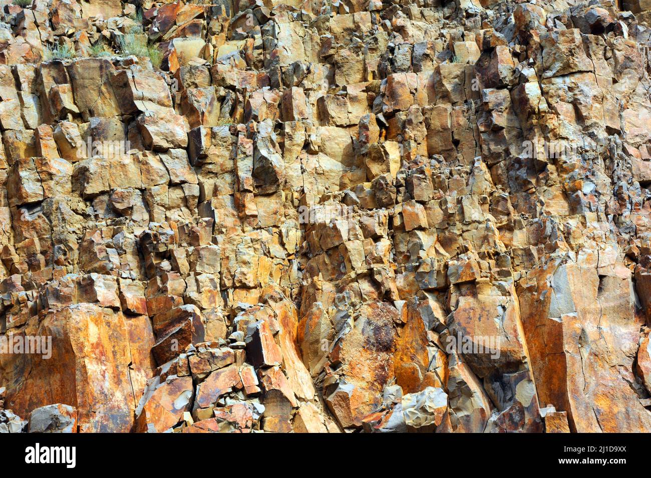 Background image of chisled section of solid rock. Section of mountain ...
