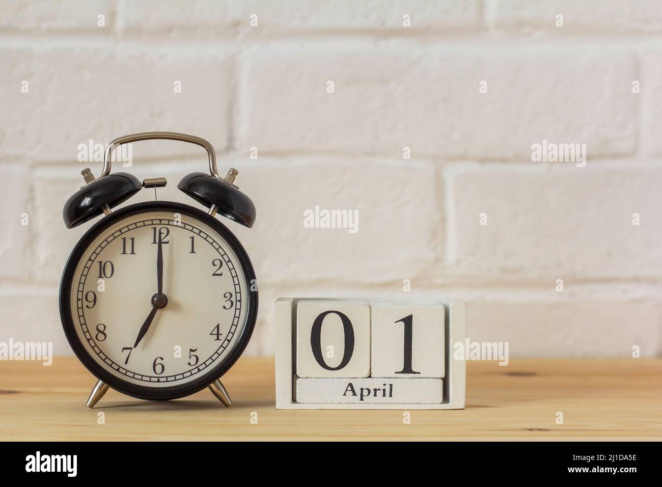 April 1 on a wooden white calendar. April 1 on a light background ...