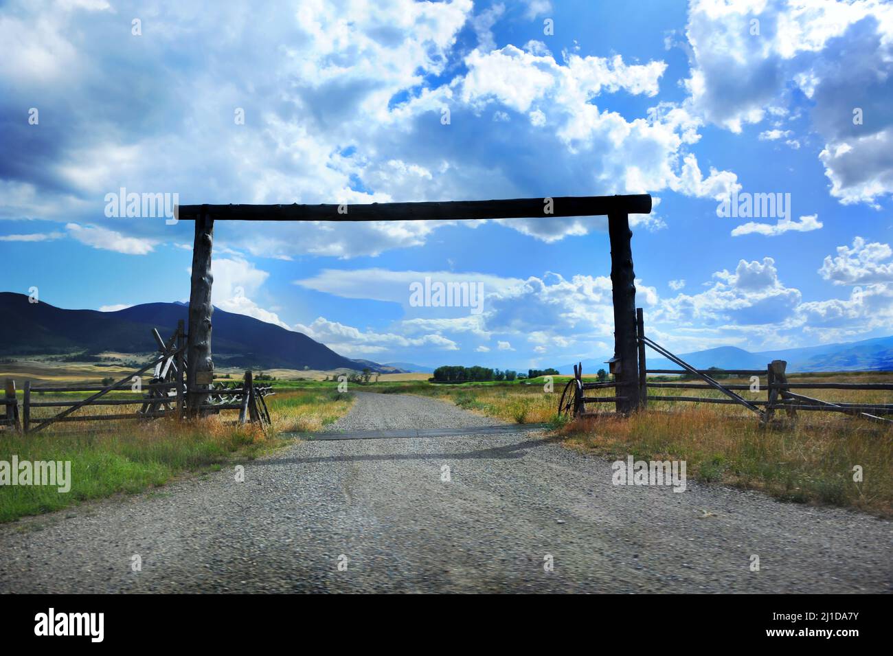Popular architecture for a country entry, this weathered log ...