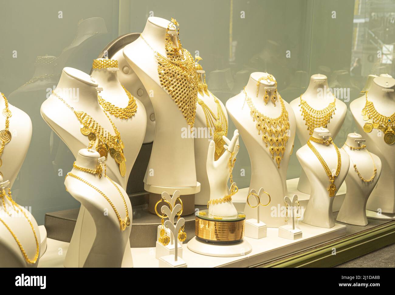 luxury gold jewelry in store window display Stock Photo - Alamy