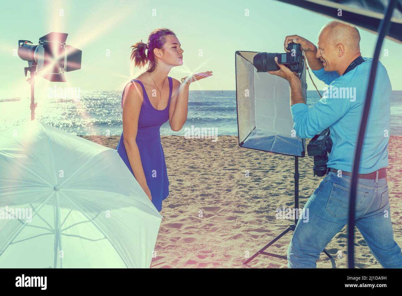 Professional photo shooting outdoors. happy female model posing Stock ...