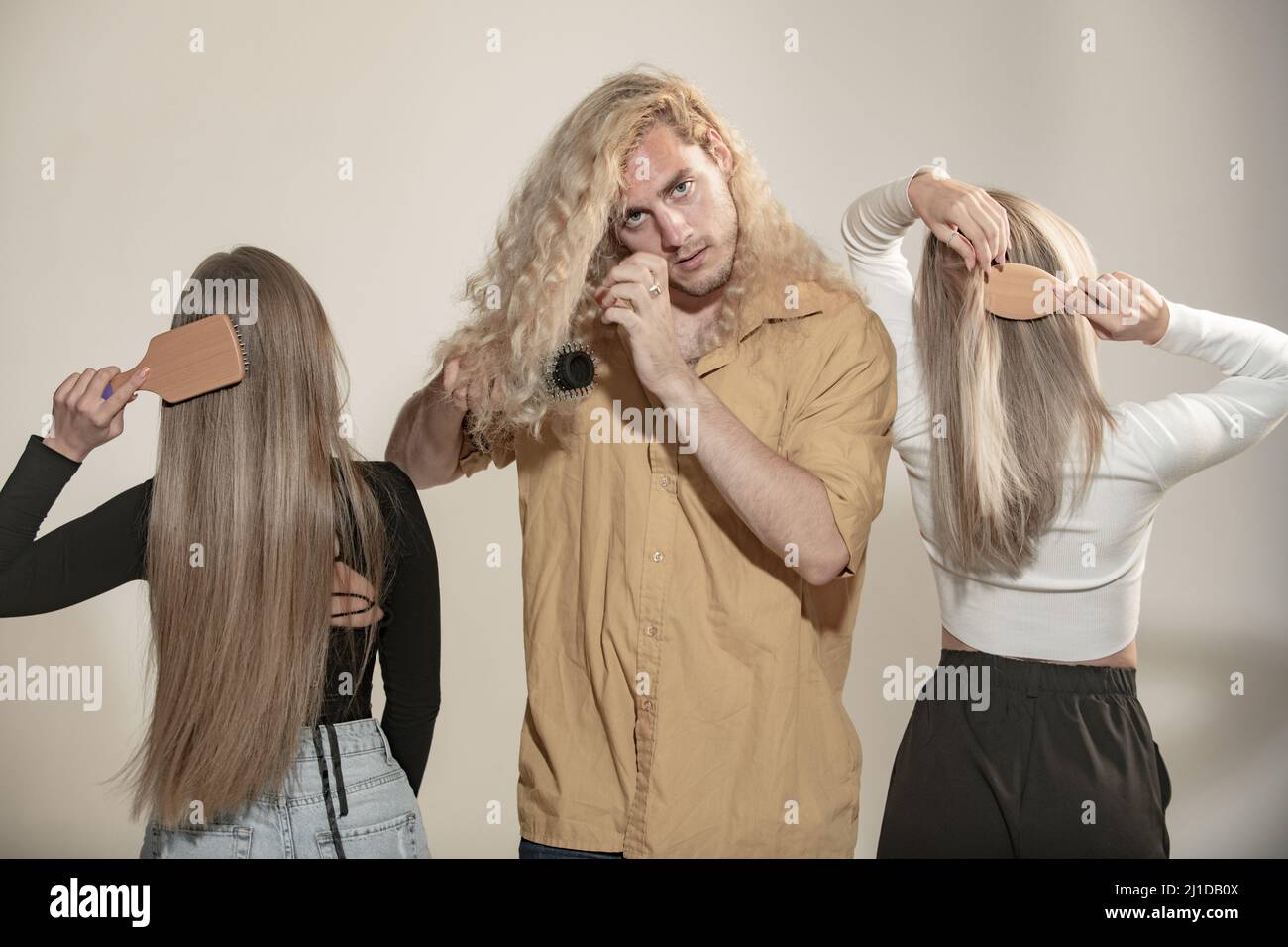 Group young people with healthy long and curly hair with brush ...