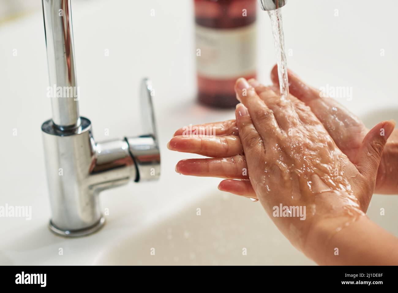 Stay healthy by washing your hands. Cropped shot of an unrecognizable ...