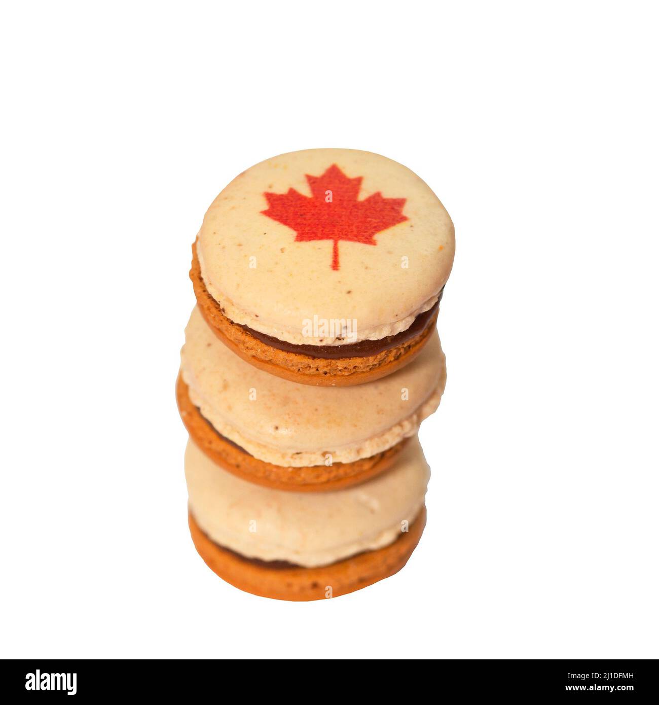 Stack of maple macarons decorated with red maple leaf made for Canada ...