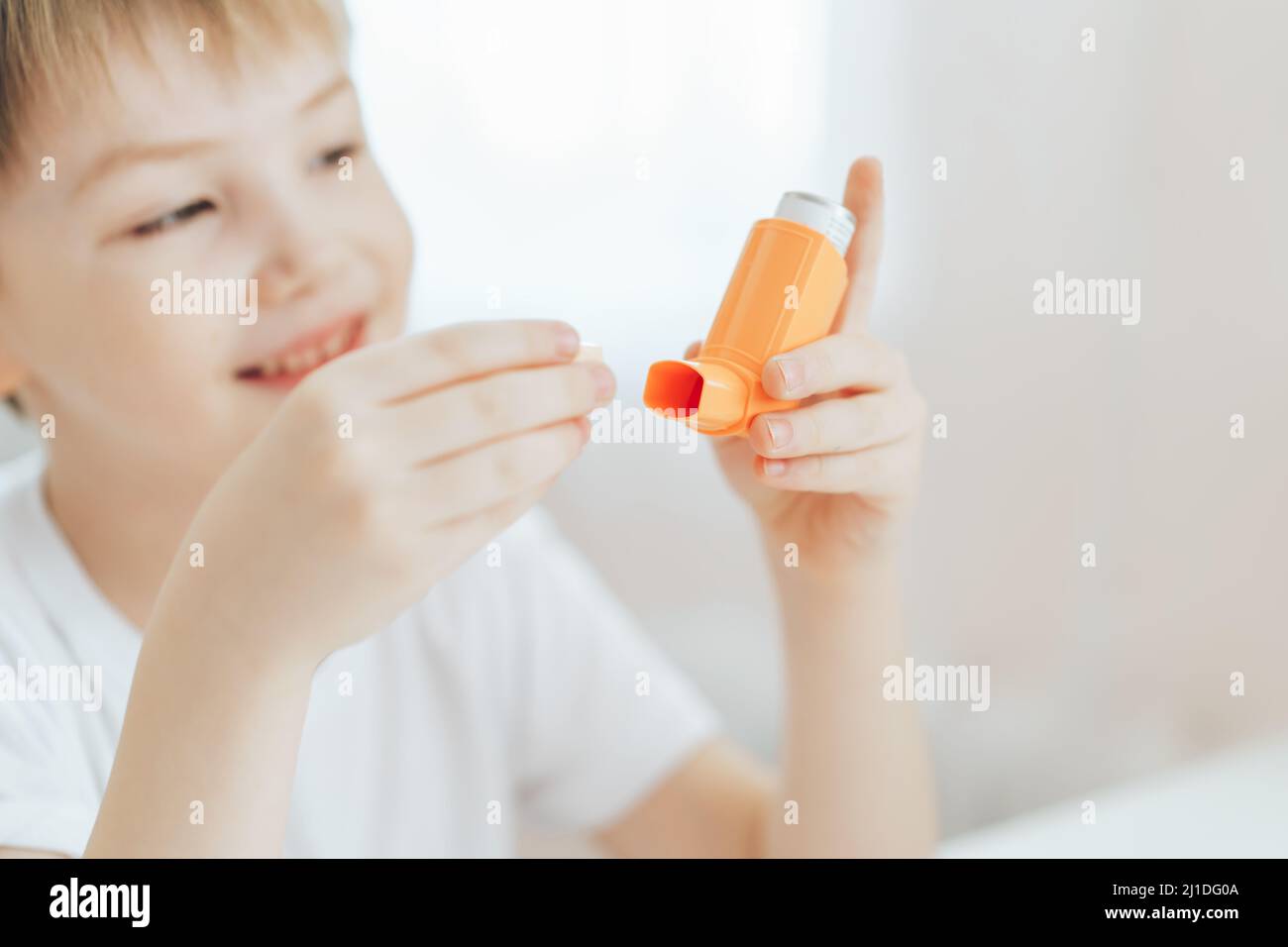 Boy opened the lid and examines the inhaler Stock Photo - Alamy