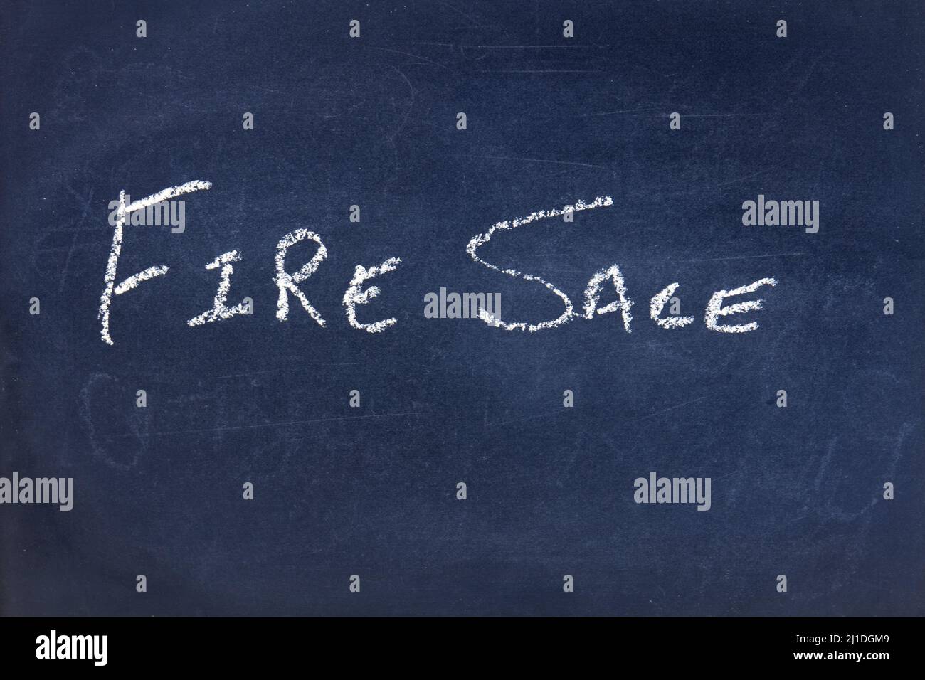 The term FIRE SALE visually displayed on a clear background with copy ...