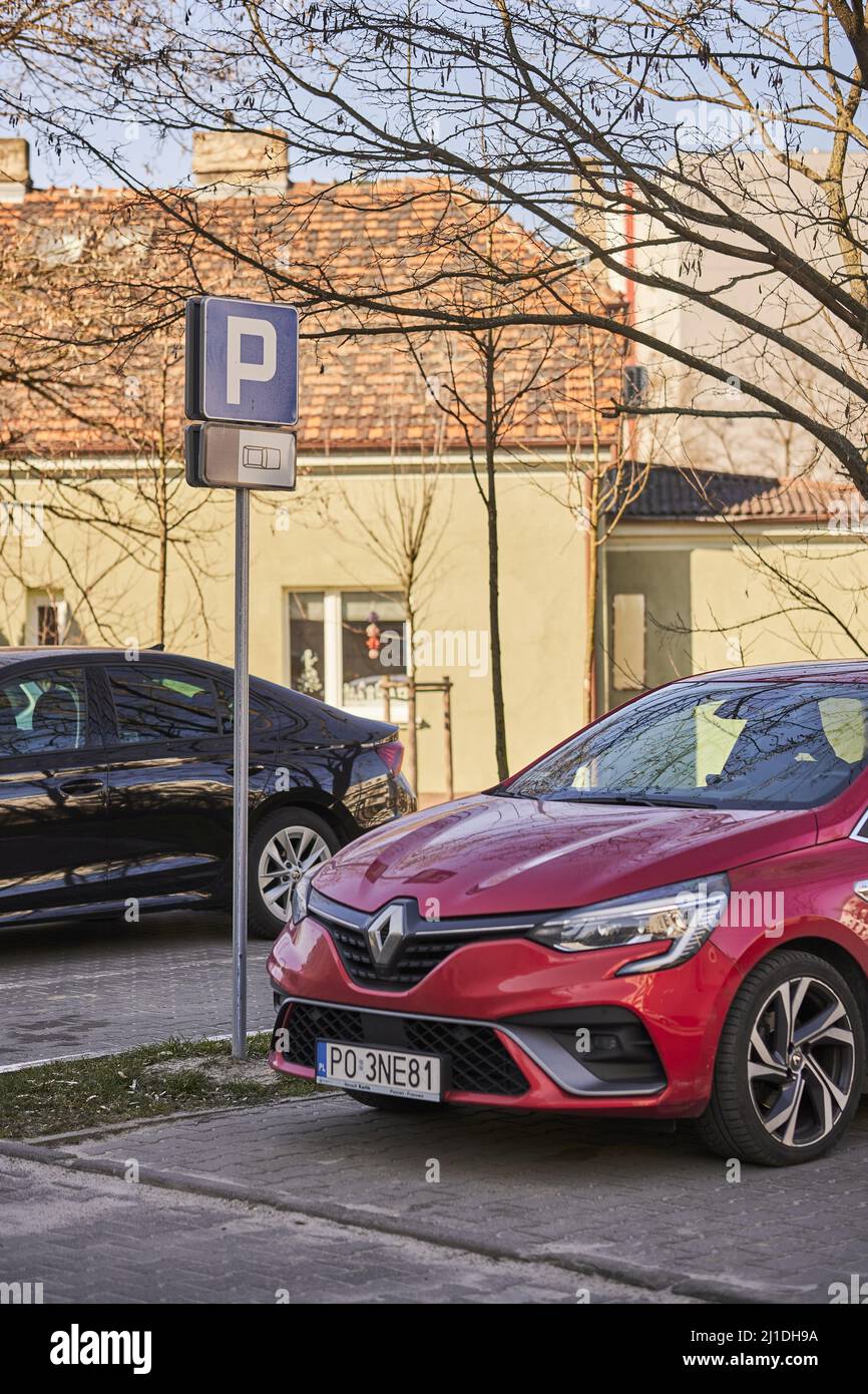 A vertical shot of a red Renault car parked on the street of the Stare ...