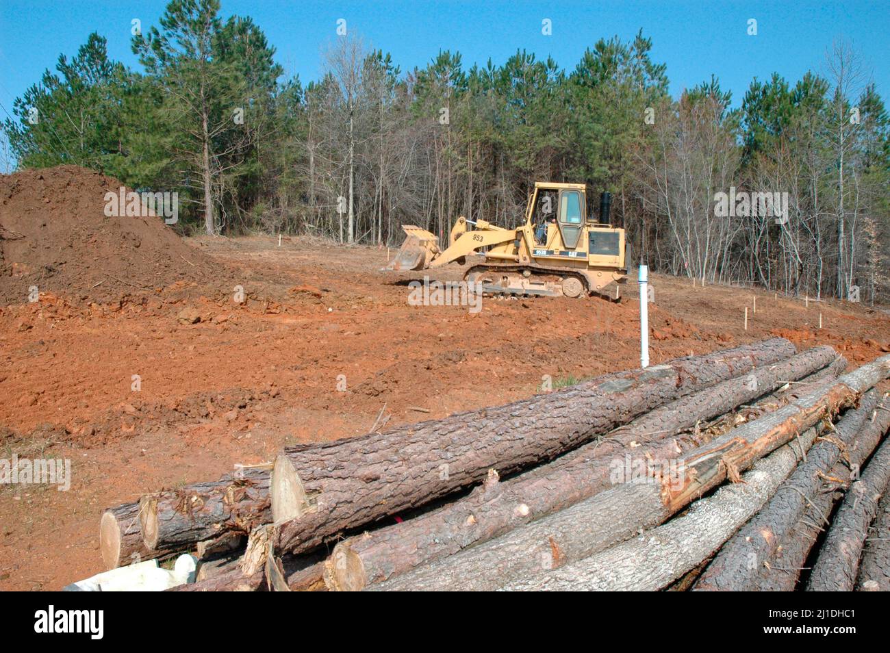 Clearing an leveling lots of trees for new house construction, with ...