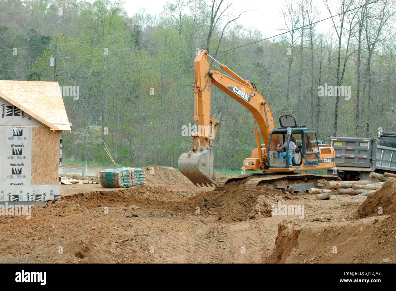 Clearing an leveling lots of trees for new house construction, with ...