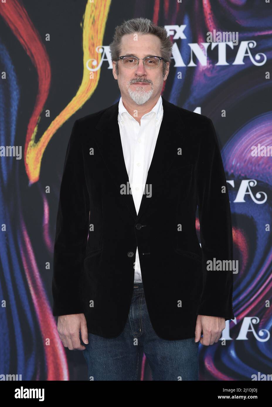 Executive Producer Paul Simms walking on the red carpet at the red ...