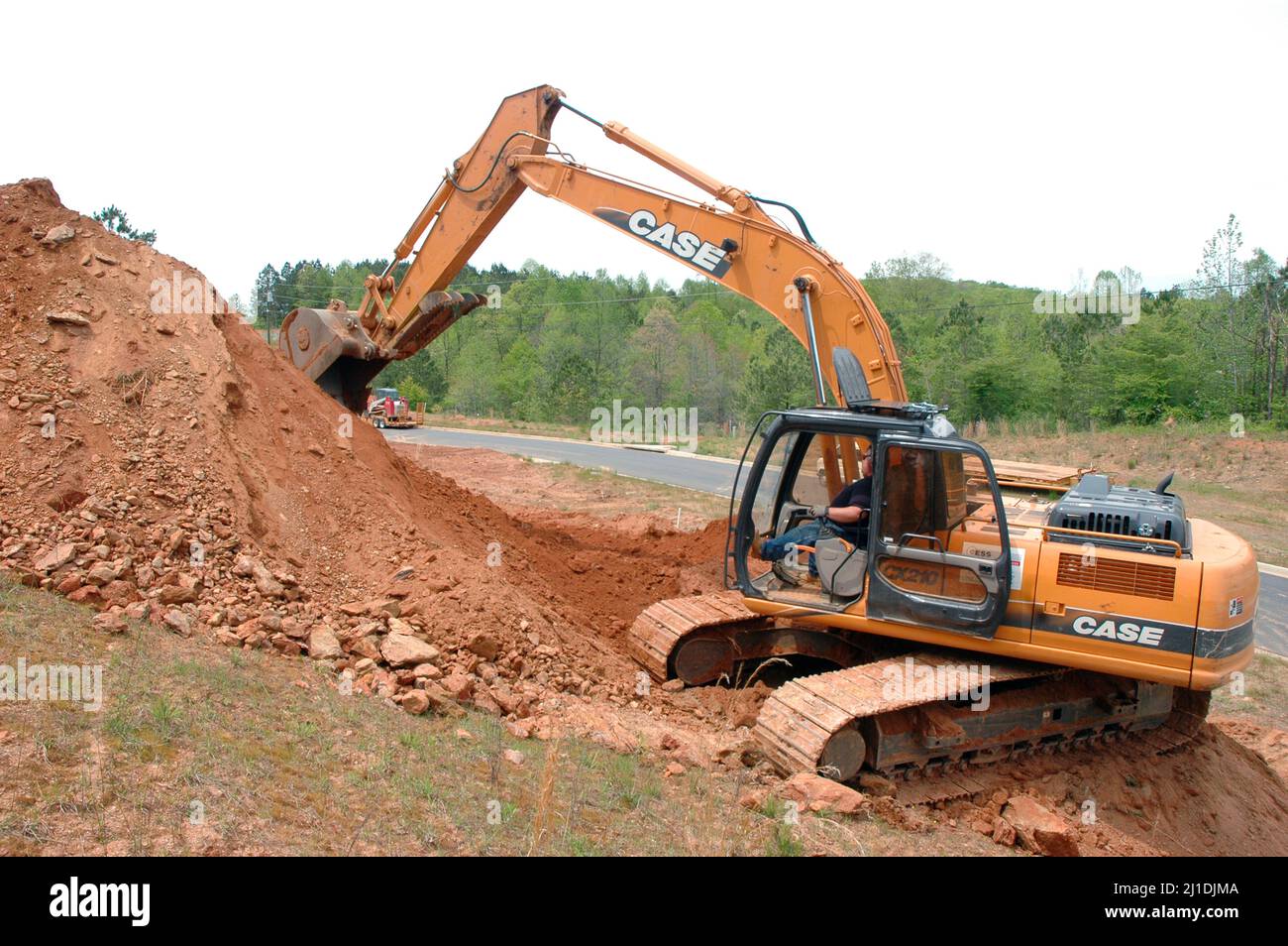 Clearing an leveling lots of trees for new house construction, with ...