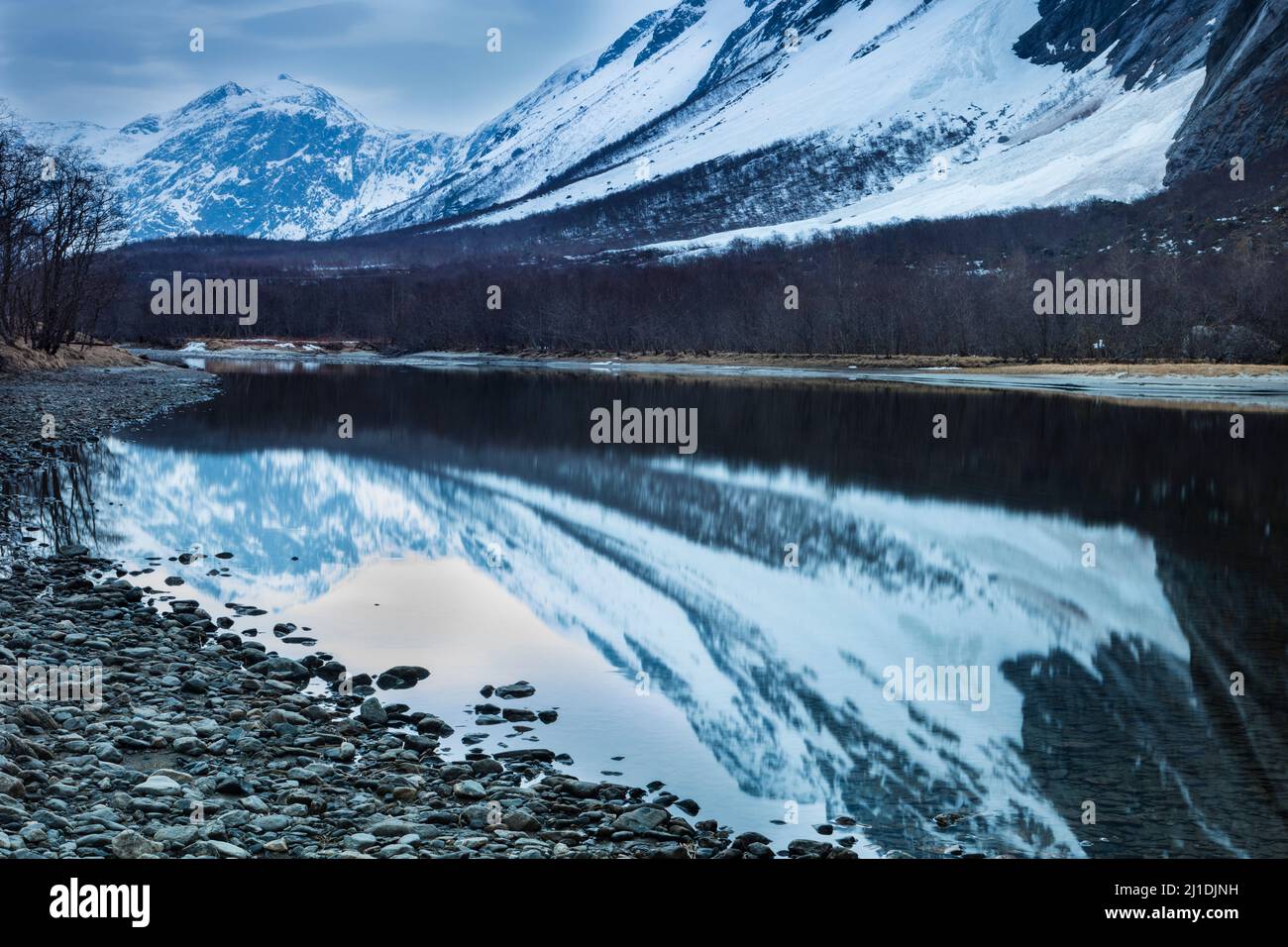 Beautiful blue hour landscape of snowy mountains reflected in Rauma ...