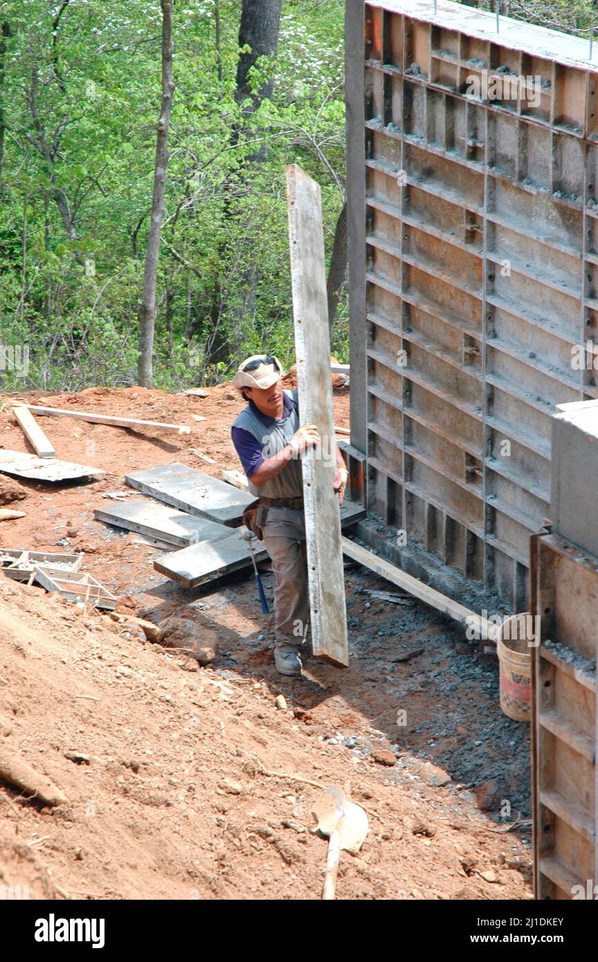 Taking down steel re-usable house basement wall construction foundation ...
