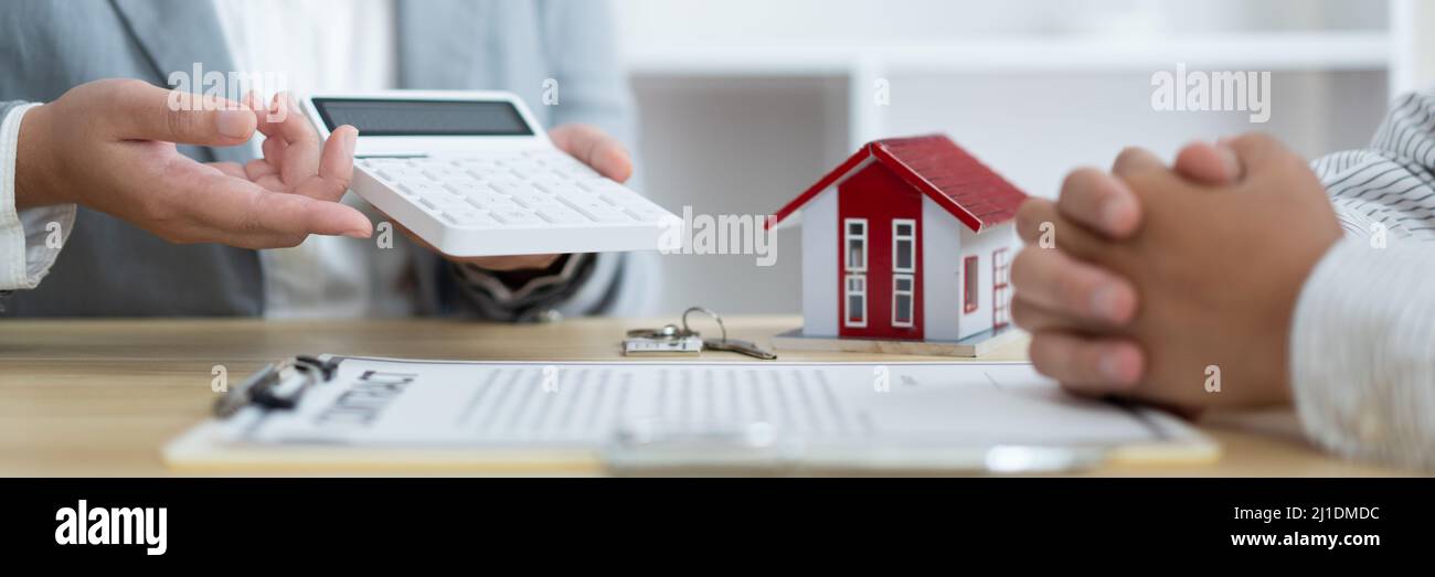The selling agent informing his client about the expense by showing it ...