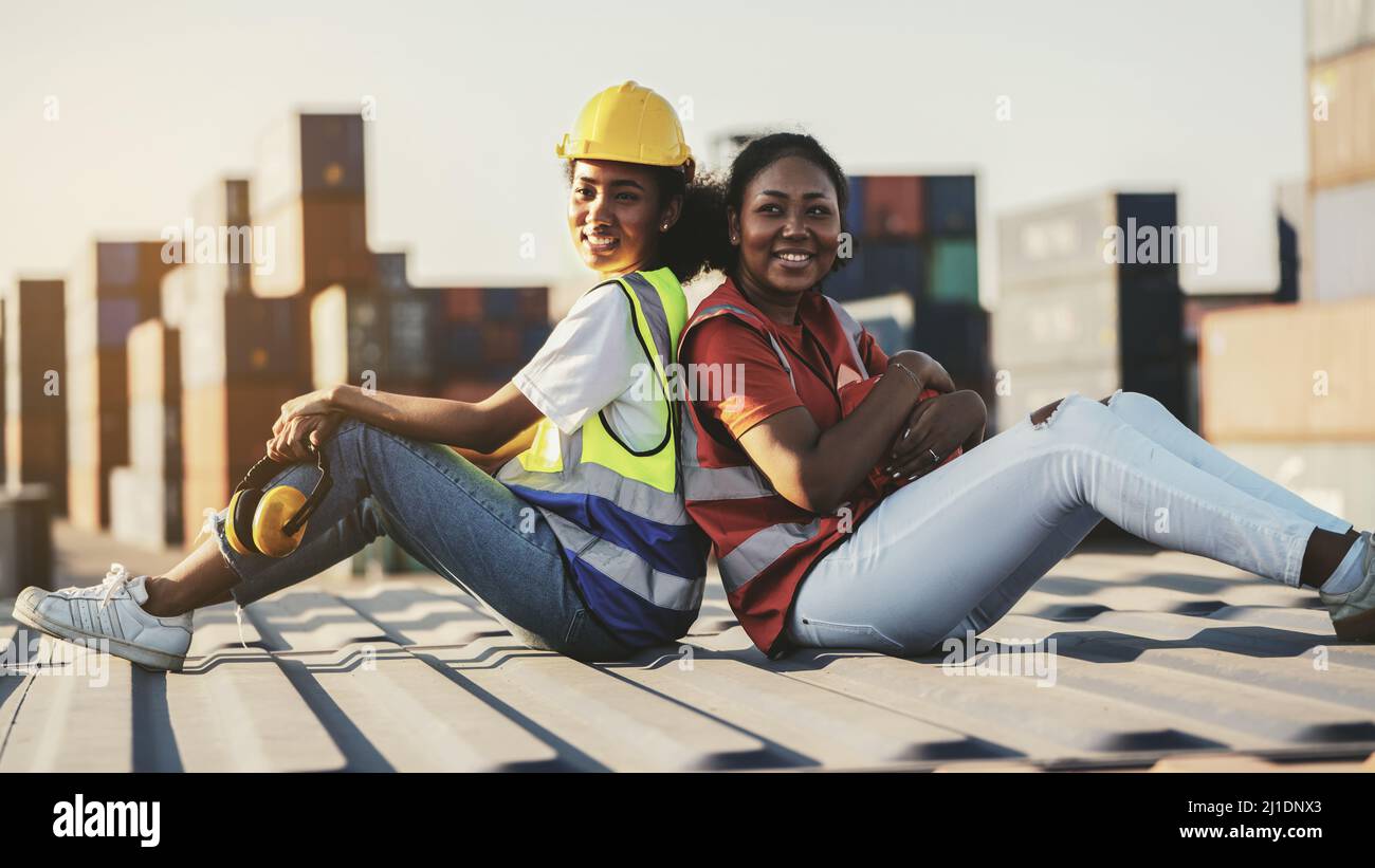 African american Woman foreman or inspector suppervisor sitting down ...