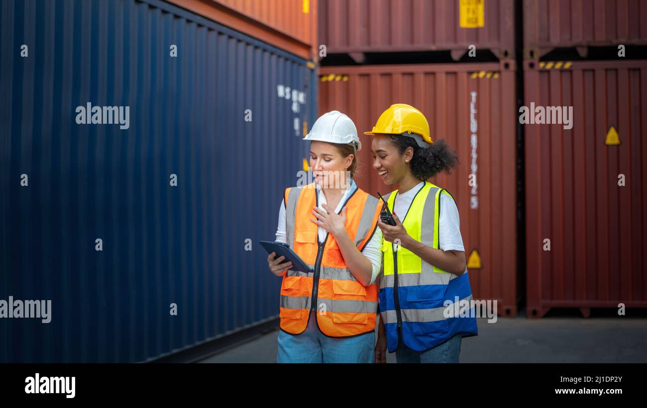 CEO or Manager in white helmet holding tablet and Woman foreman ...