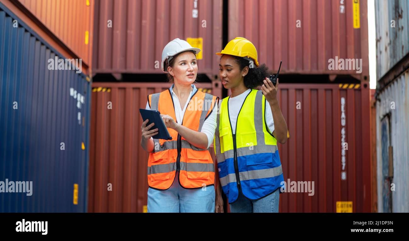 CEO or Manager in white helmet holding tablet and Woman foreman ...