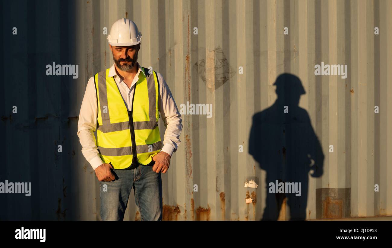 CEO or Manager in white helmet control loading Containers box in ...