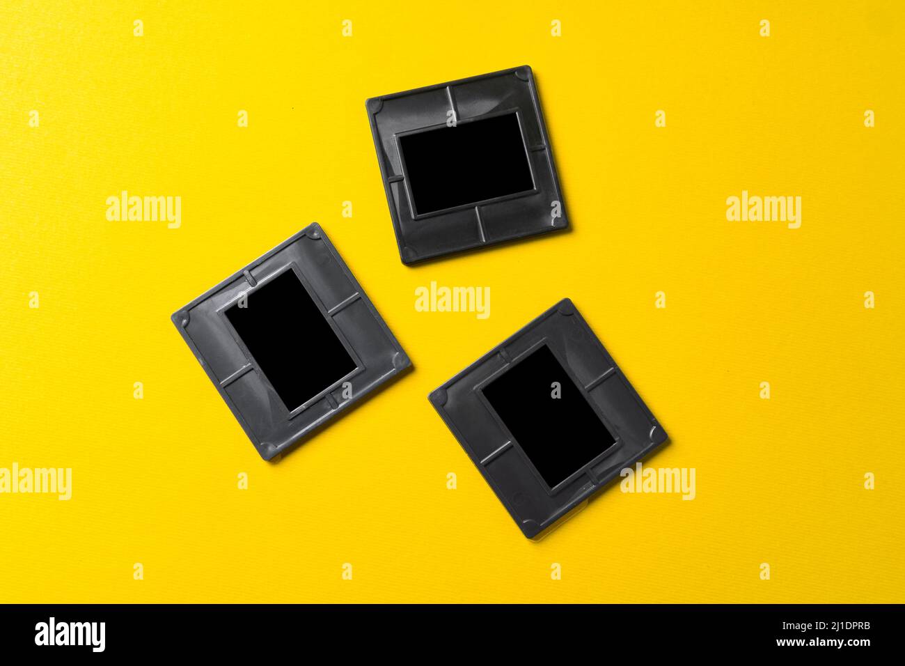 Photography empty slide frames on yellow background Stock Photo - Alamy