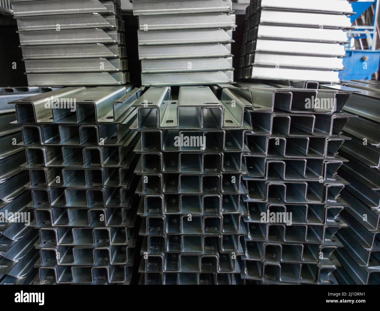 full frame view on stacks of profile bent sheet metal parts Stock Photo ...