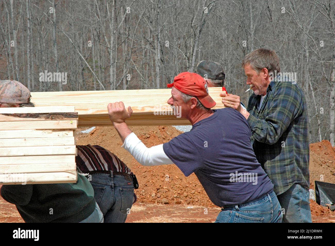 Delivering lumber by truck and fork lift the materials for wood framing ...