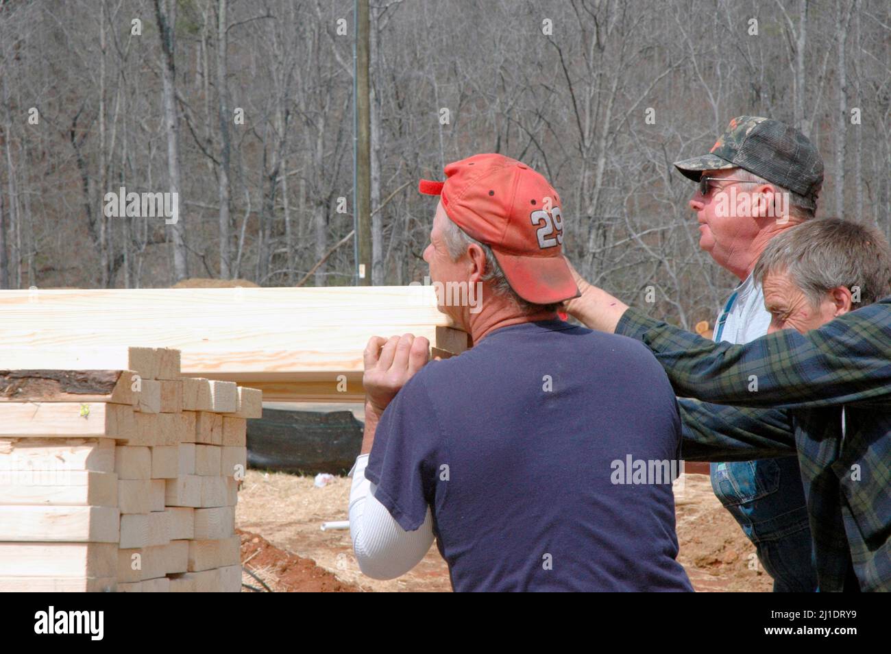 Delivering lumber by truck and fork lift the materials for wood framing ...