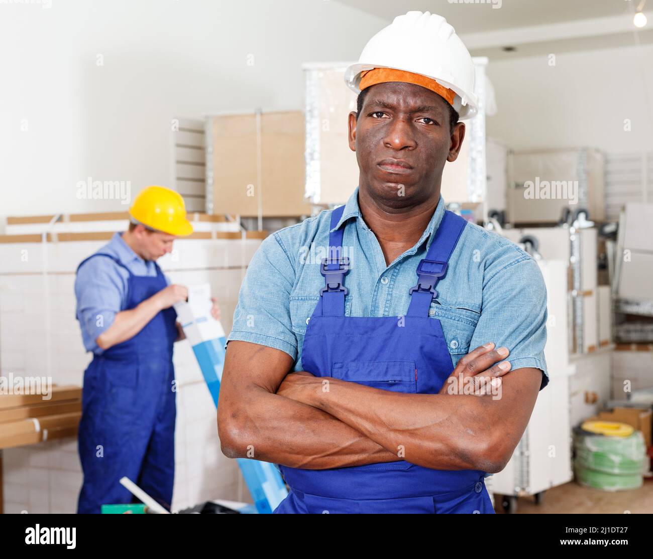 Confident African-American construction worker Stock Photo - Alamy
