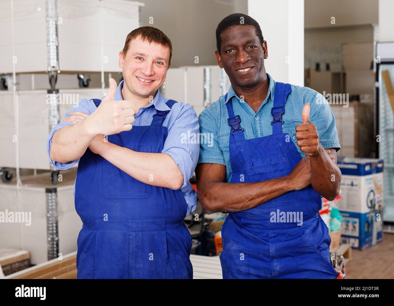 Two confident construction workers Stock Photo - Alamy