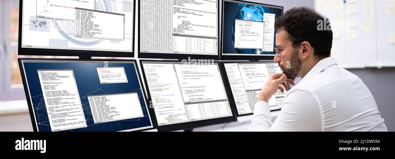 Software Developer Programming On Computer Monitor Screens Stock Photo ...