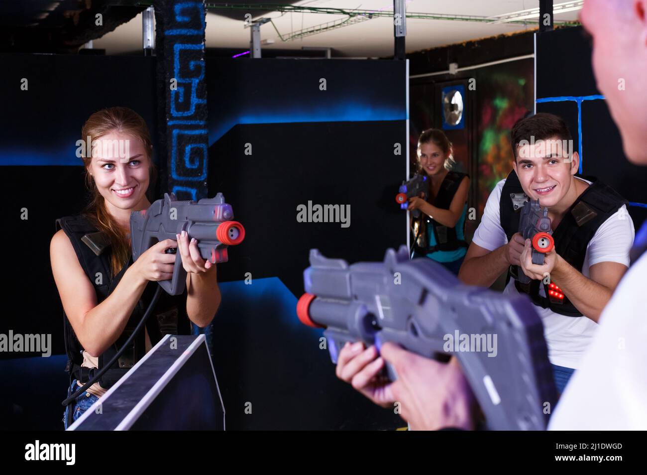Young people playing laser tag Stock Photo - Alamy