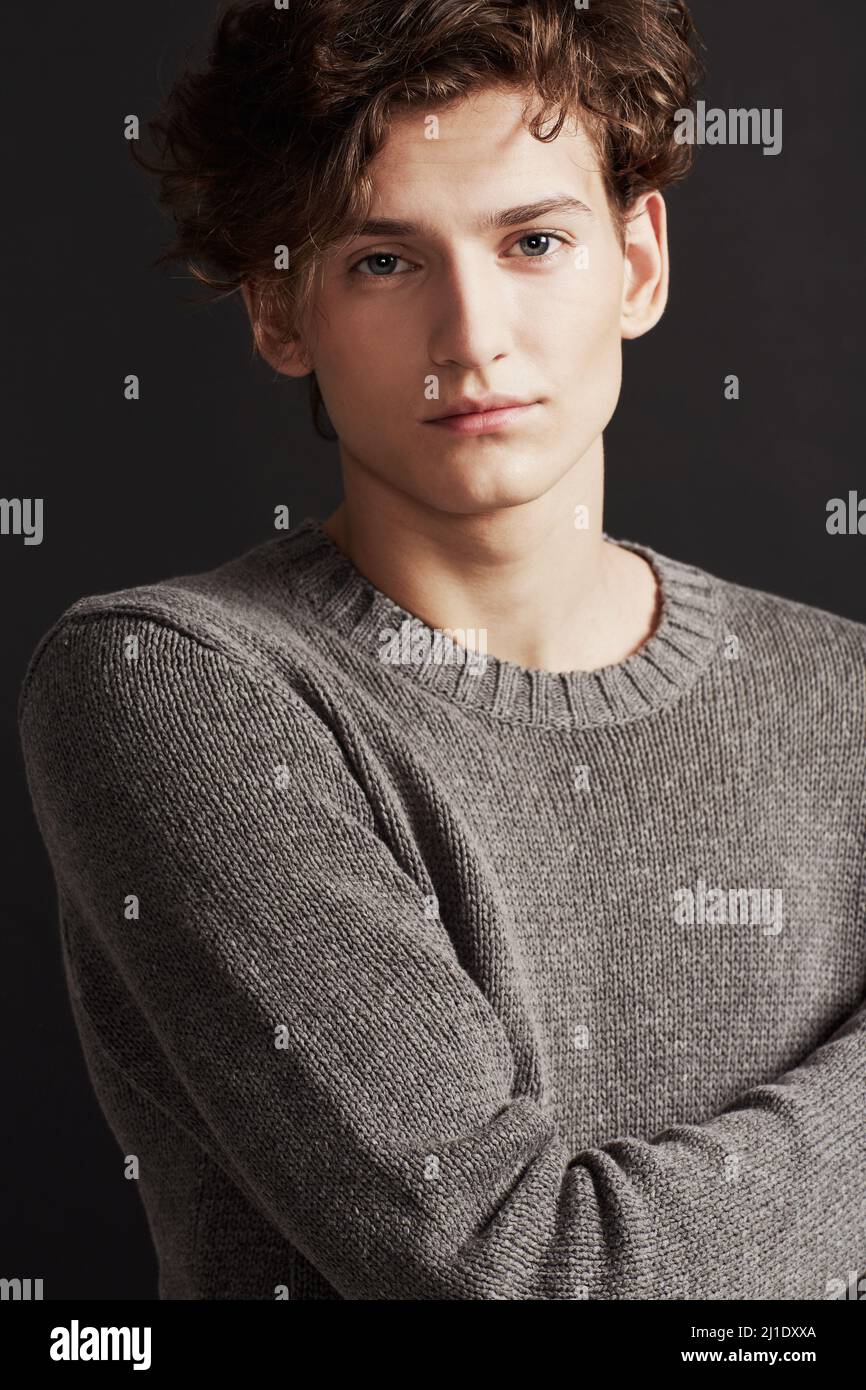 Honest eyes. A young man with elegant facial features wearing the ...