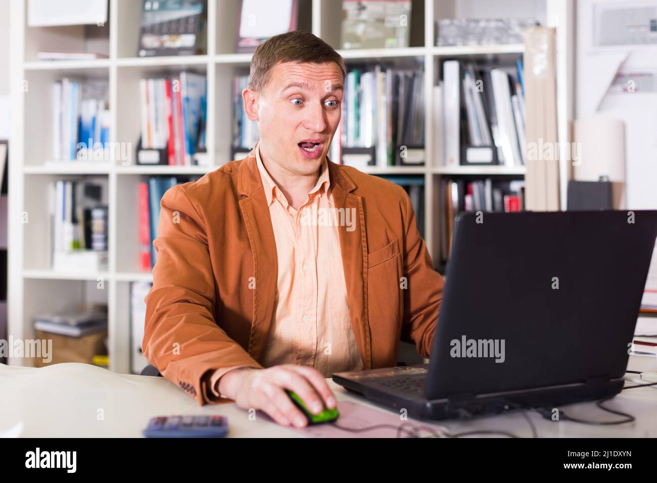 Surprised happy male manager hi-res stock photography and images - Alamy