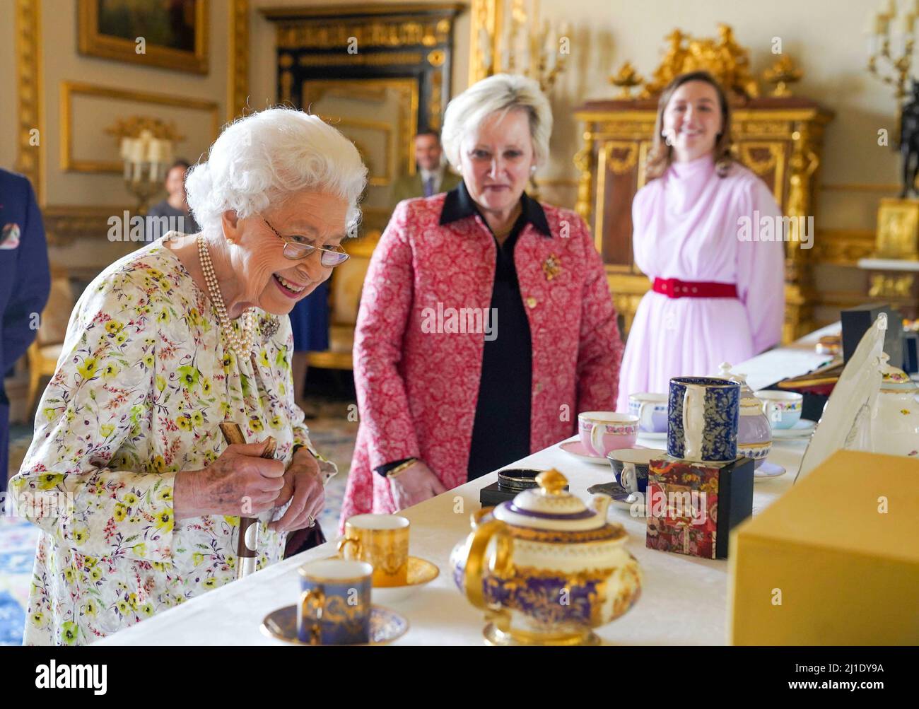 Queen Elizabeth II talks to Pamela Harper (centre) from British ...