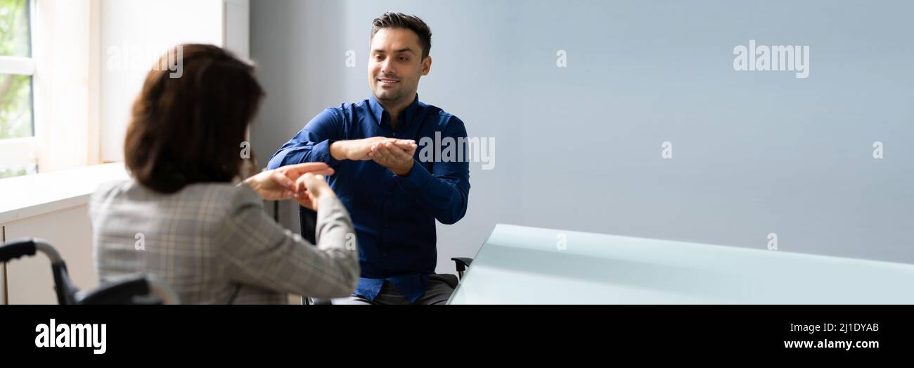 Learning Sign Language For Deaf People In Office Stock Photo - Alamy
