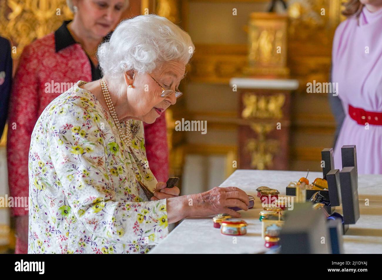 Queen Elizabeth II views a display of artefacts from British craftwork ...