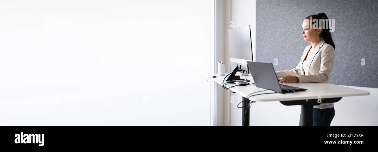 Adjustable Height Office Desk. Working While Standing Stock Photo - Alamy