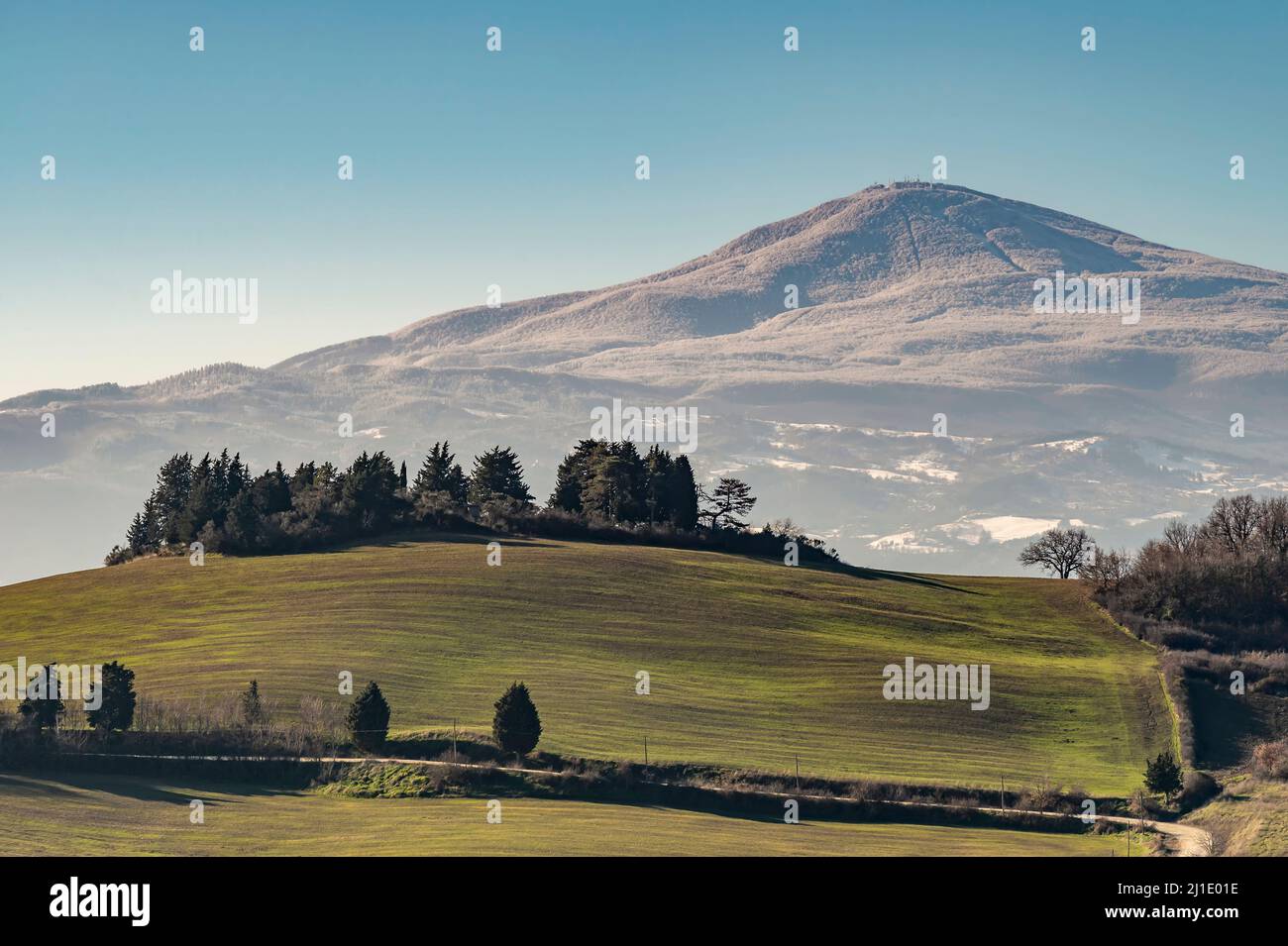 View of Monte Amiata covered by snow from the Monticchiello area, Siena ...