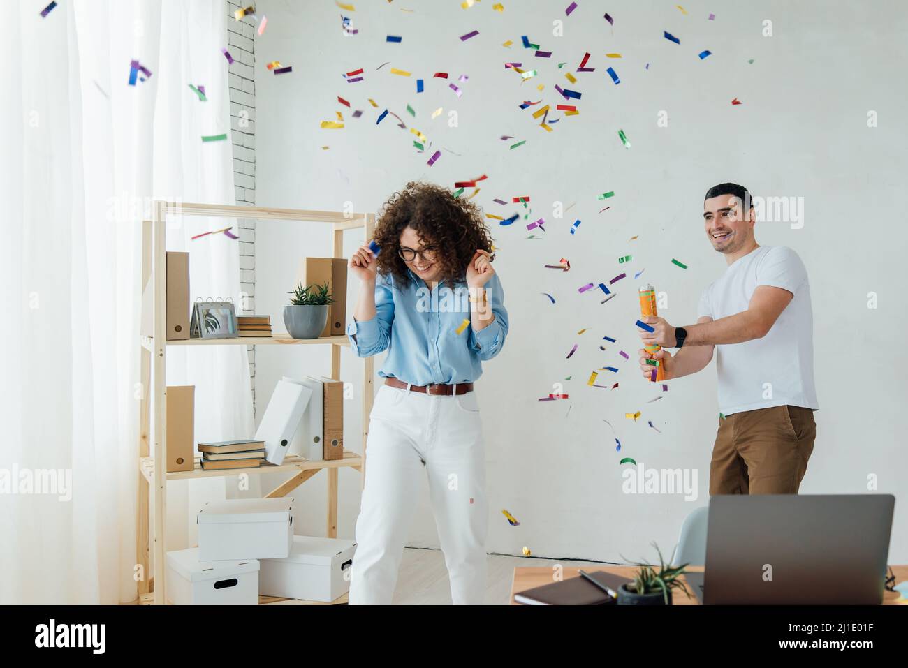 Happy colleagues dancing in office hi-res stock photography and images ...