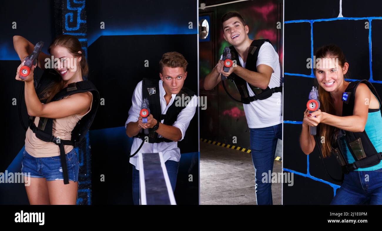Young team playing laser tag game Stock Photo - Alamy