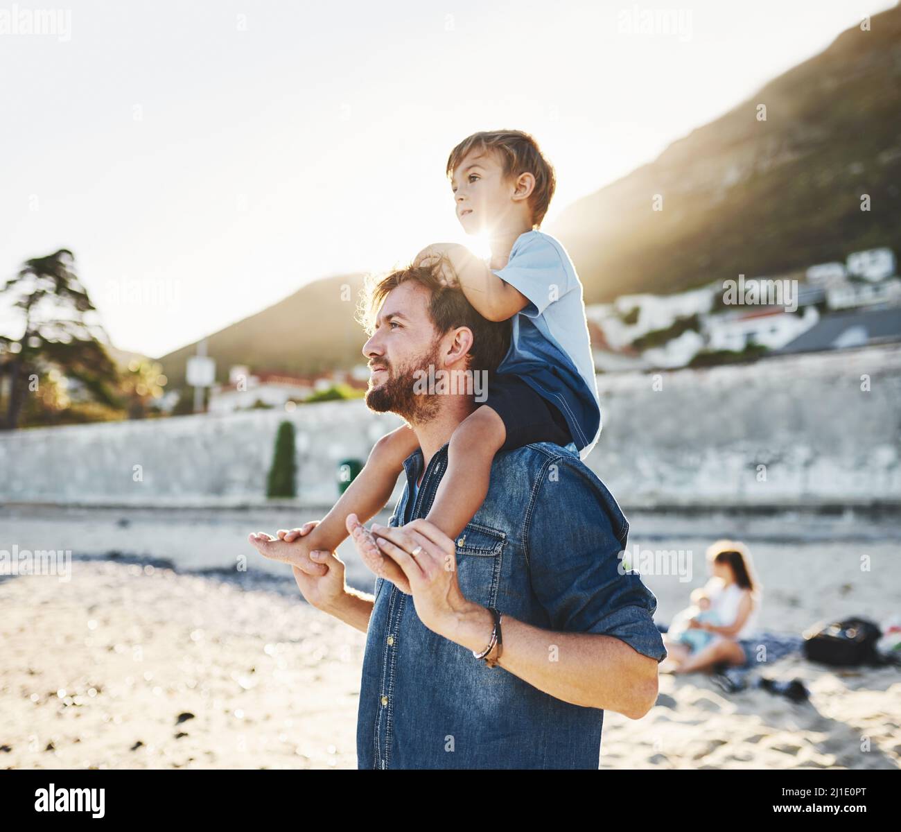 Child sitting on an adults shoulders hi-res stock photography and ...