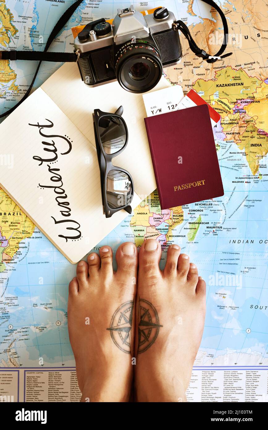 Go dip your feet in a distant ocean. High angle shot of a young ...