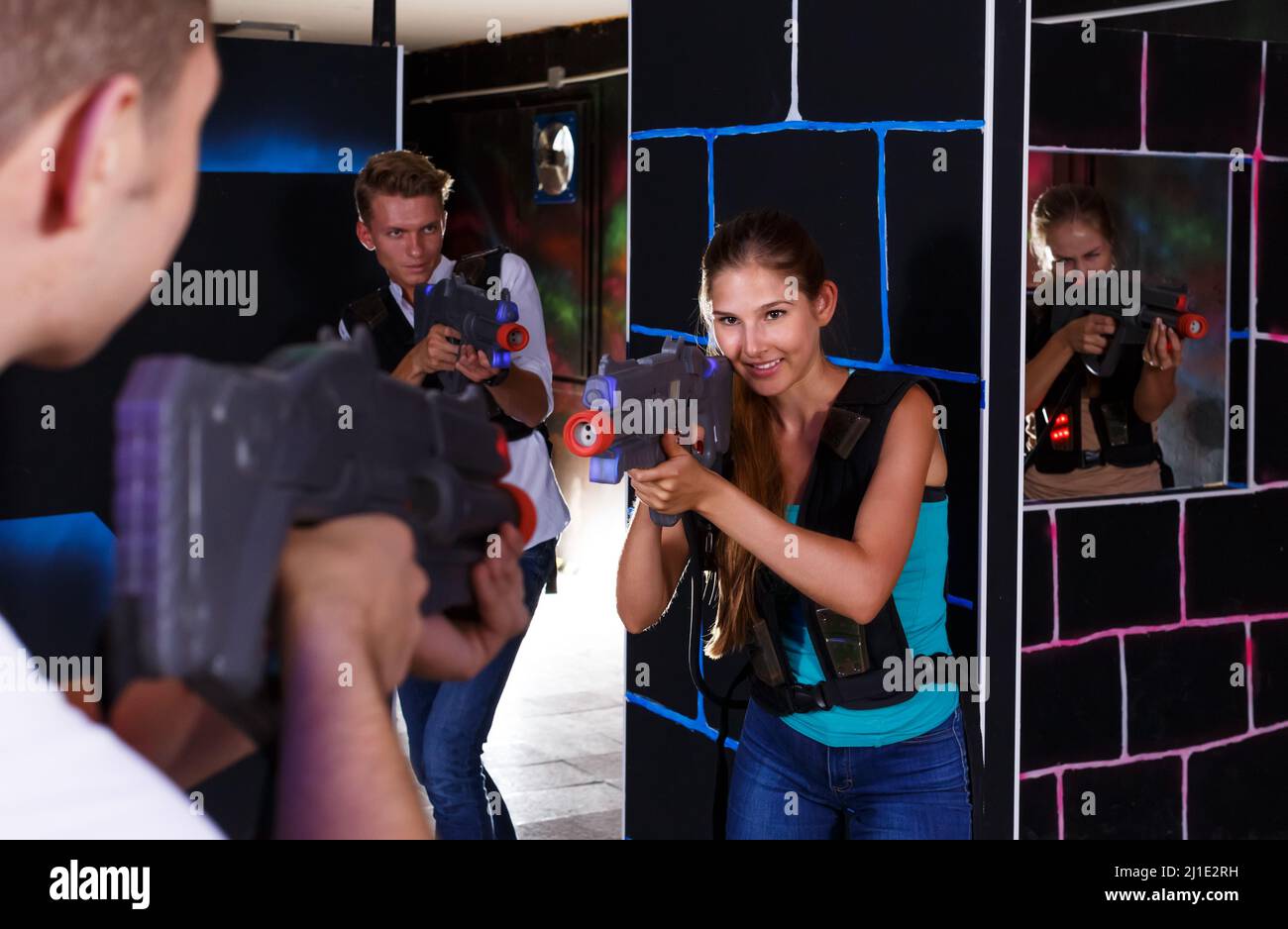 Young people playing laser tag Stock Photo - Alamy